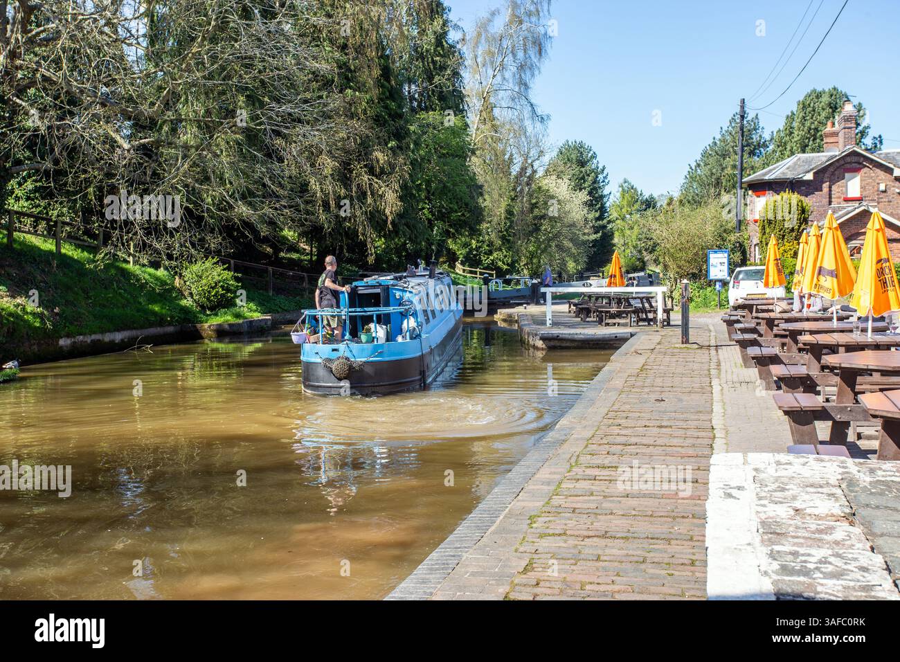 Canal narrowboat passing the Shroppie Fly pub on the Shropshire union ...