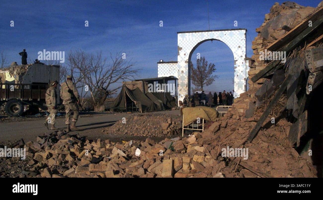 Dec 20, 2001; Kandahar, AFGHANISTAN; US Marines from Task Force-58 head toward an Afghani manned ...