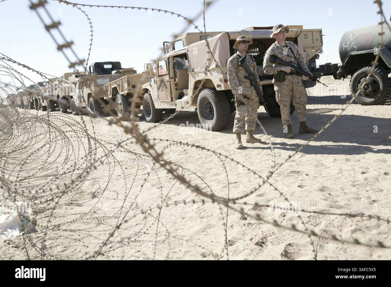 Feb 10, 2004; Camp Victory, Kuwait; Pfc. VINCE O. MATA and Cpl. AARON G ...