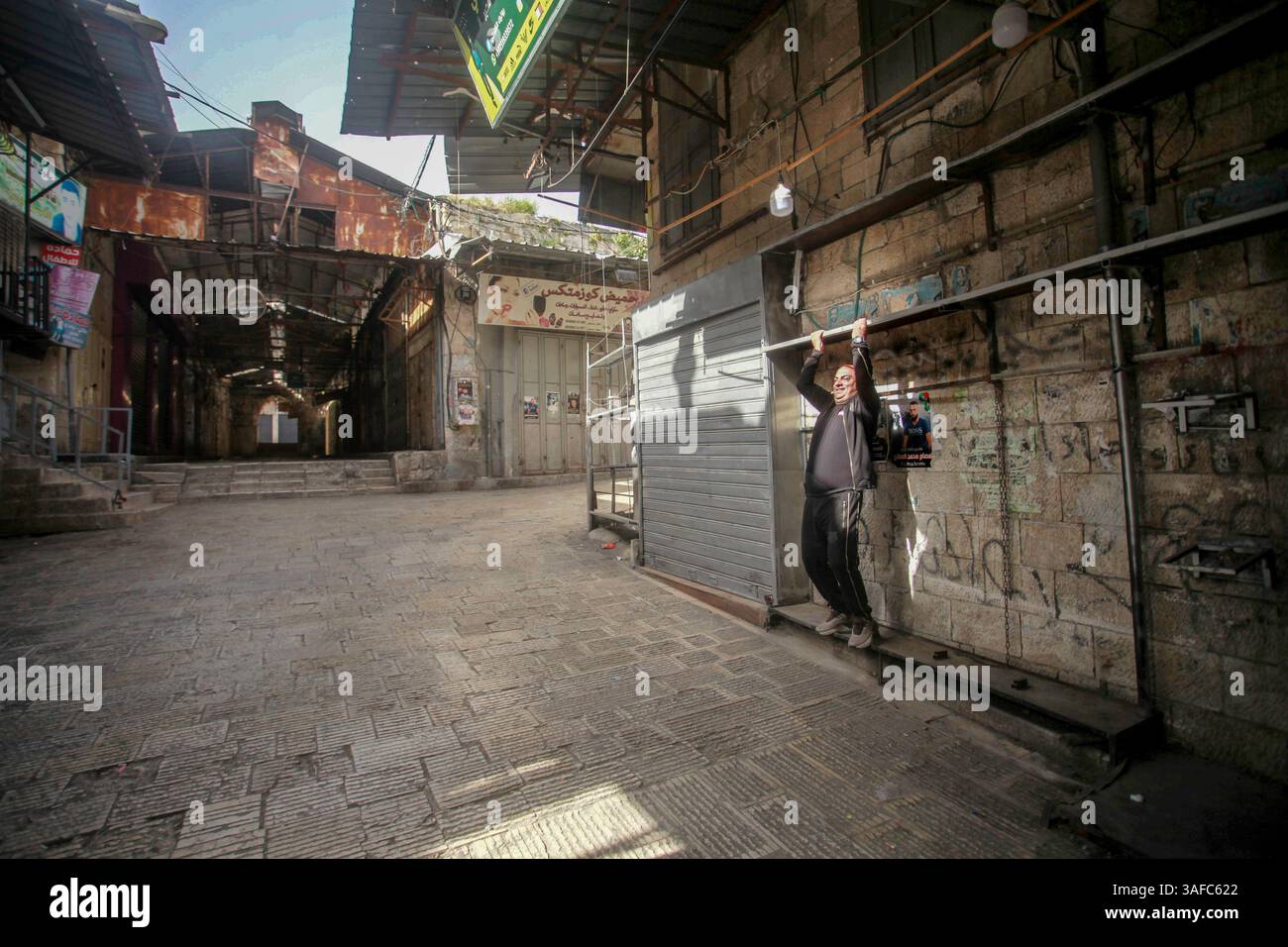 Nablus, Palestine. 07th Apr, 2025. A Palestinian man seen at a closed ...