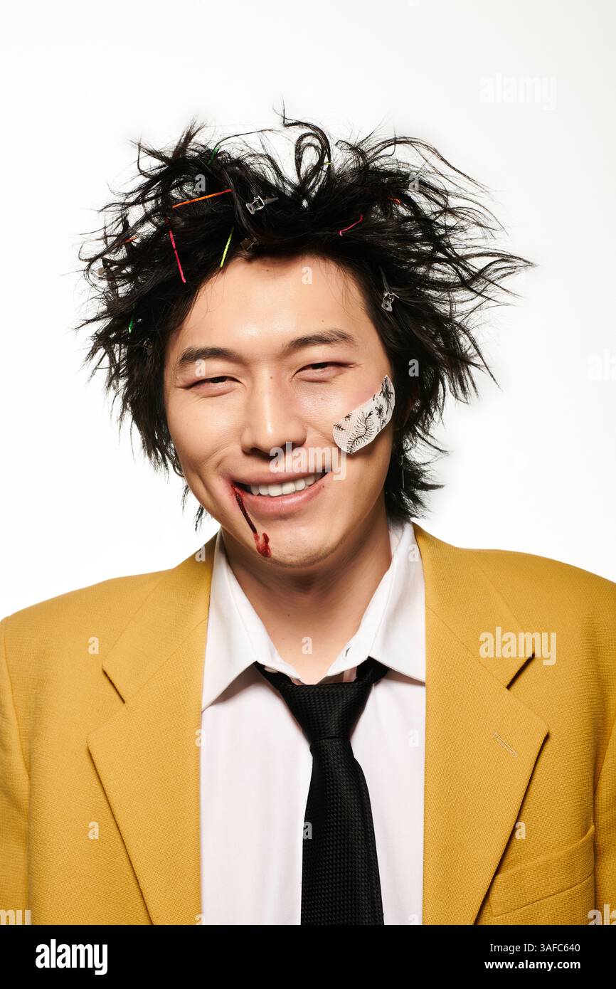 An asian man with blood on face showcases unique fashion with creative ...