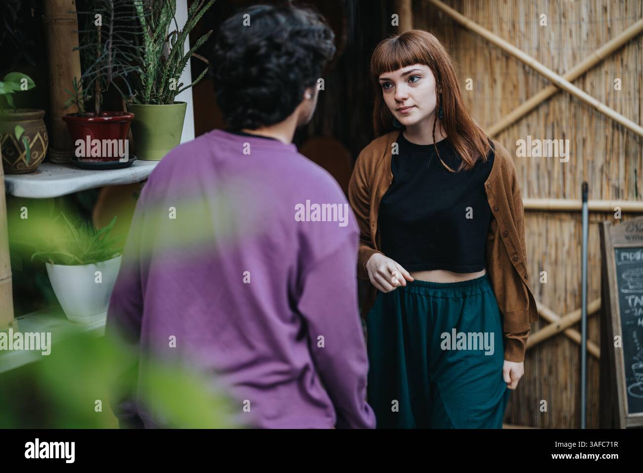 Casual conversation between two friends in a cozy setting Stock Photo ...