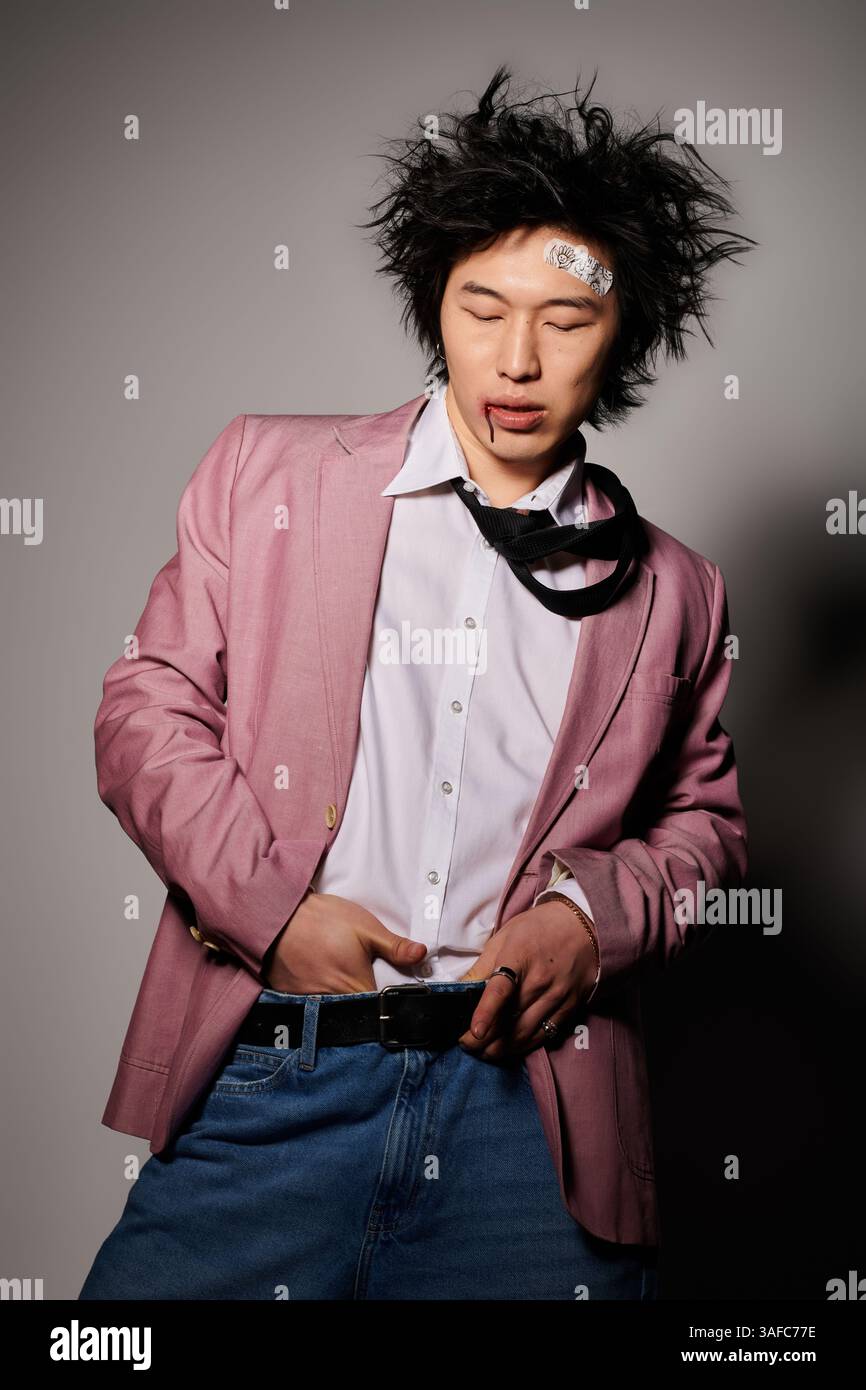 A fashionable Asian man with blood on face showcases vibrant spring ...