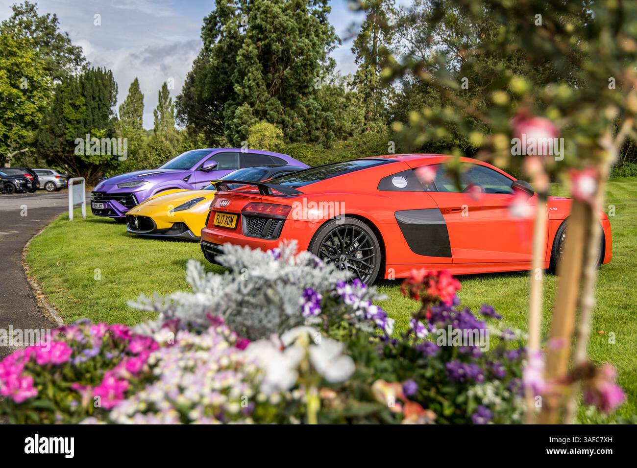 Bristol, UK- August 13, 2023: Red R8 V10 Plus Yellow Maserati MC20 and ...