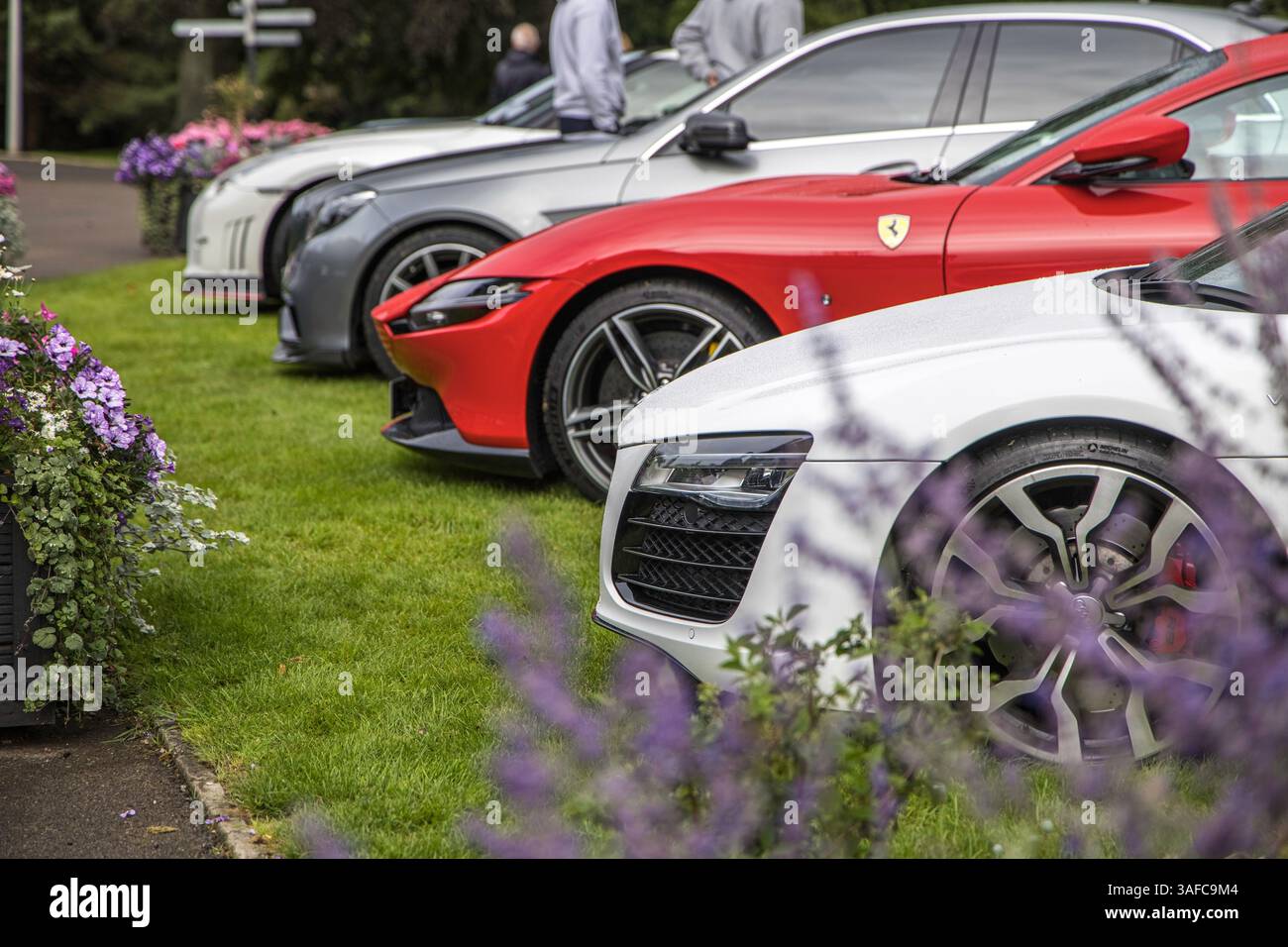 Bristol, UK- August 13, 2023: White R8 V10 Ferrari Roma Mercedes amg ...