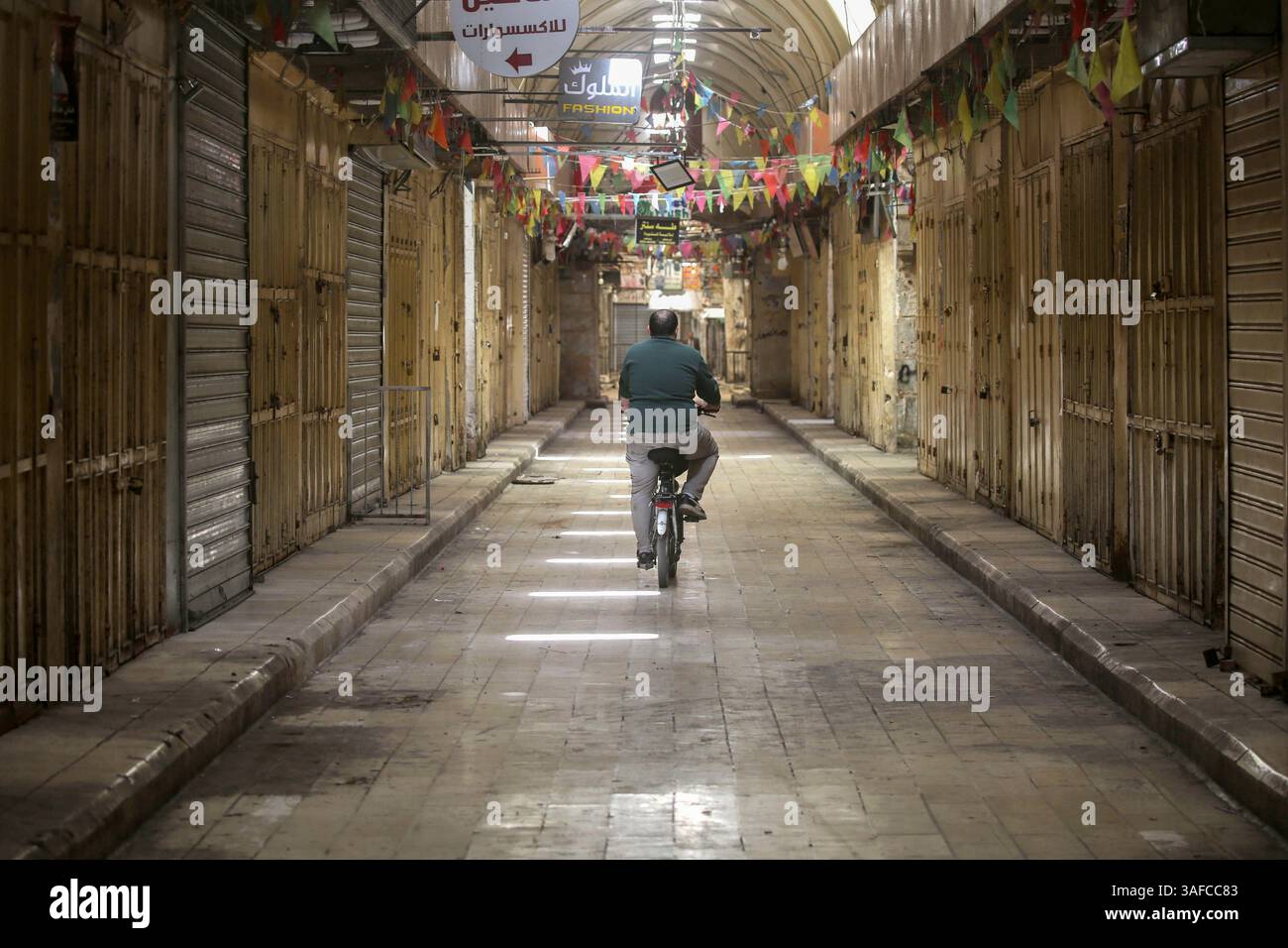 Nablus, Palestine. 07th Apr, 2025. A Palestinian rides a bicycle ...