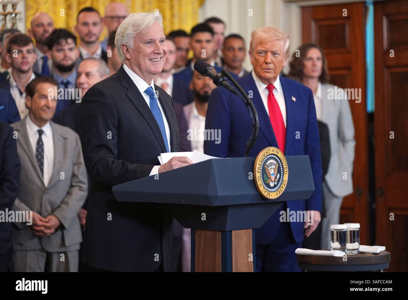 President Donald Trump listens as Los Angeles Dodgers owner and ...