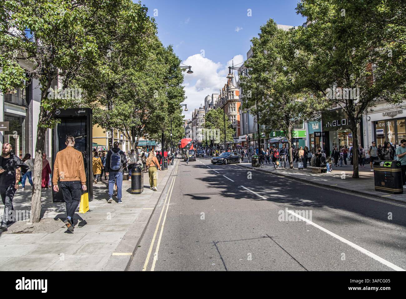 London, UK- August 6, 2023: Crowded sidewalk on Oxford Street with ...