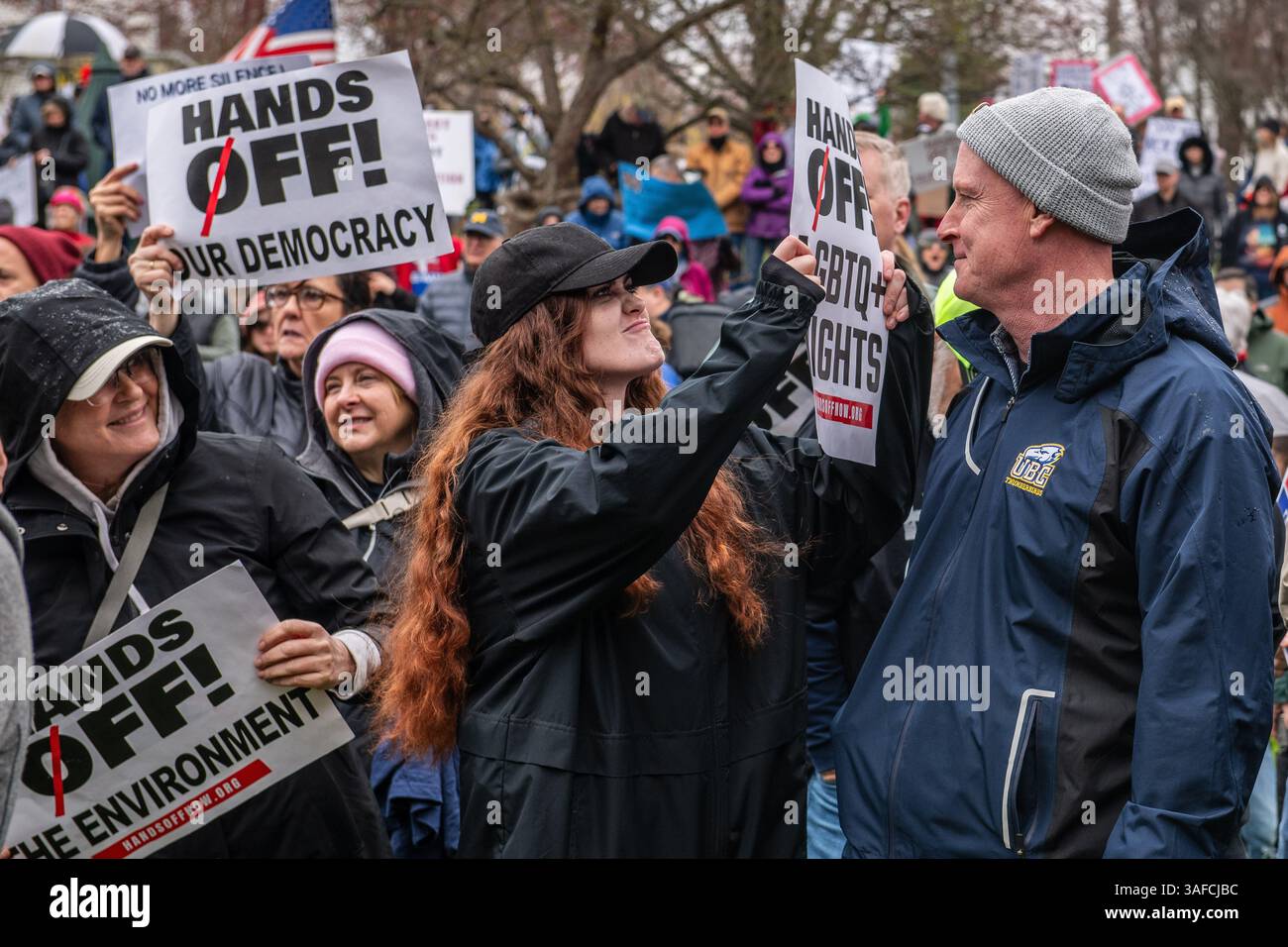 Newtown, United States. 05th Apr, 2025. Protesters chat as others hold ...