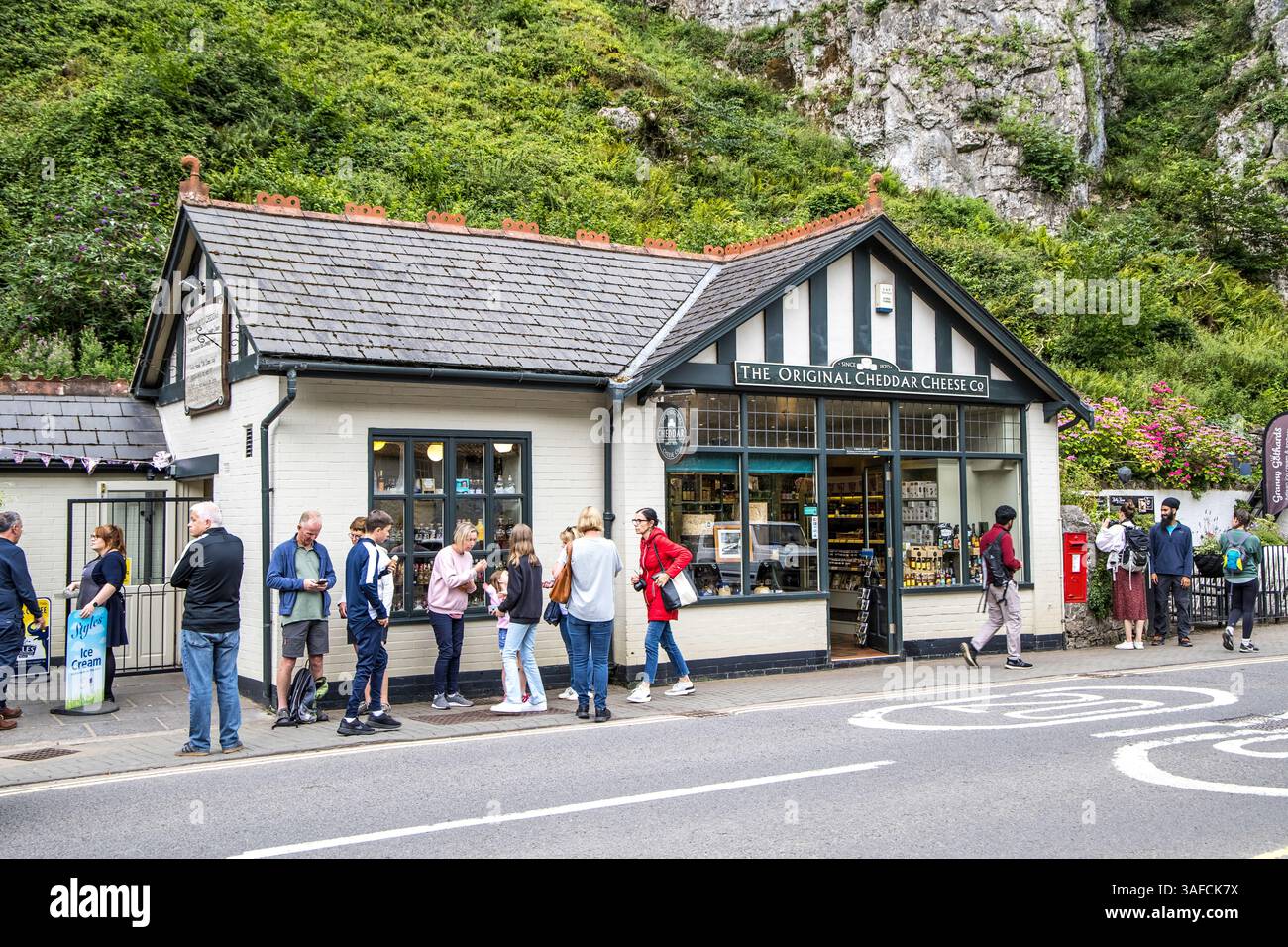 Cheddar, UK- August 4, 2023: Cheddar cheese shop full of tourists, a ...