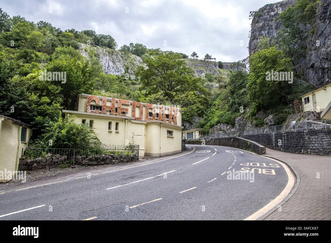 Cheddar, UK- August 4, 2023: Cheddar sign and road going through ...