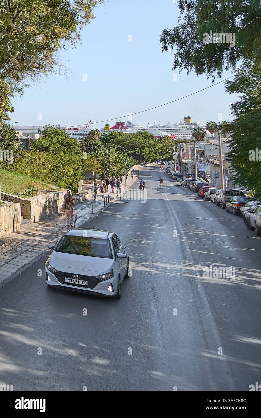 Crete, Greece - April 7, 2025: A bustling street in Crete with cruise ...