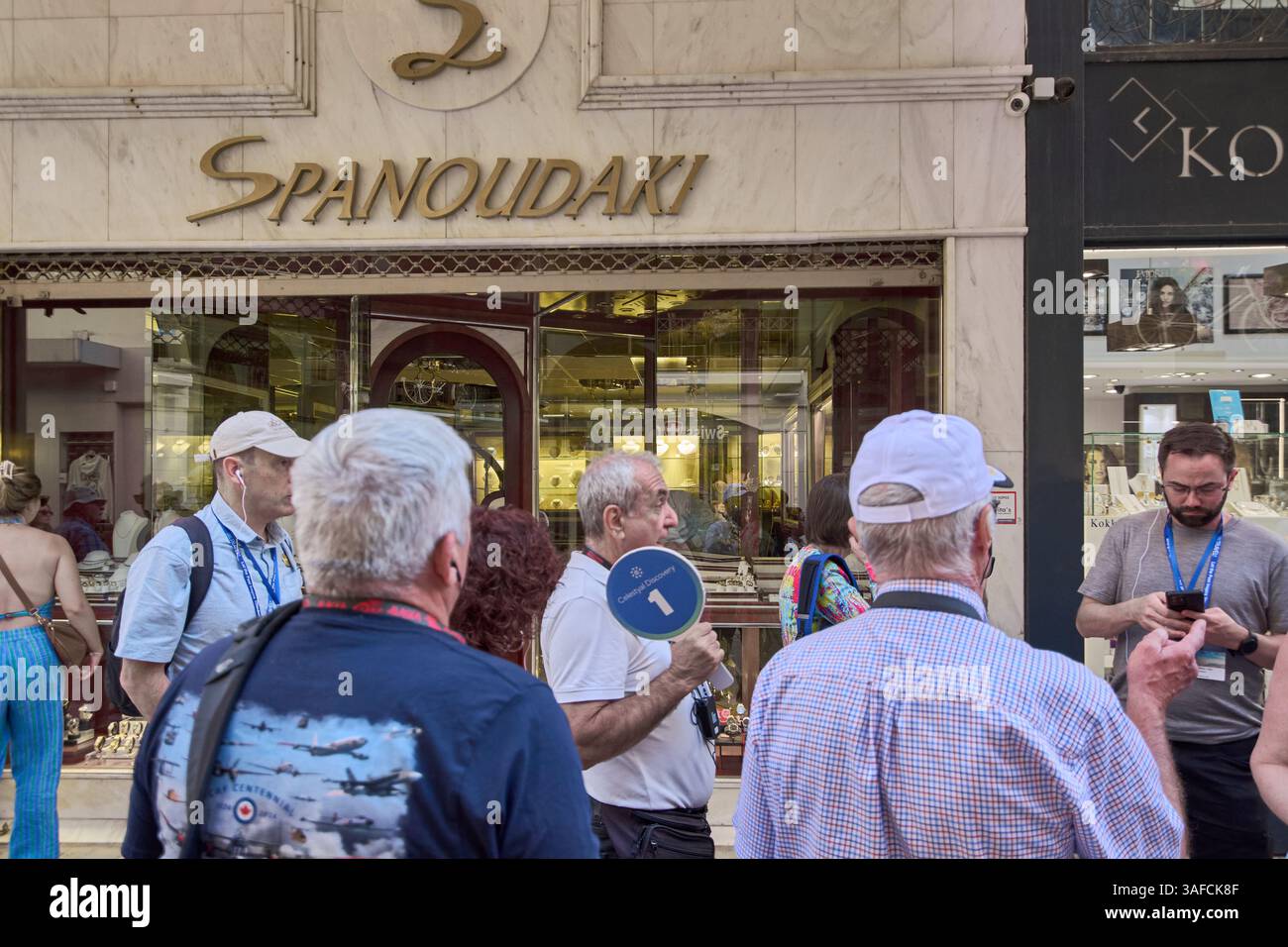 Crete, Greece - April 7, 2025: Tourists gather outside Kokkiadi jewelry ...