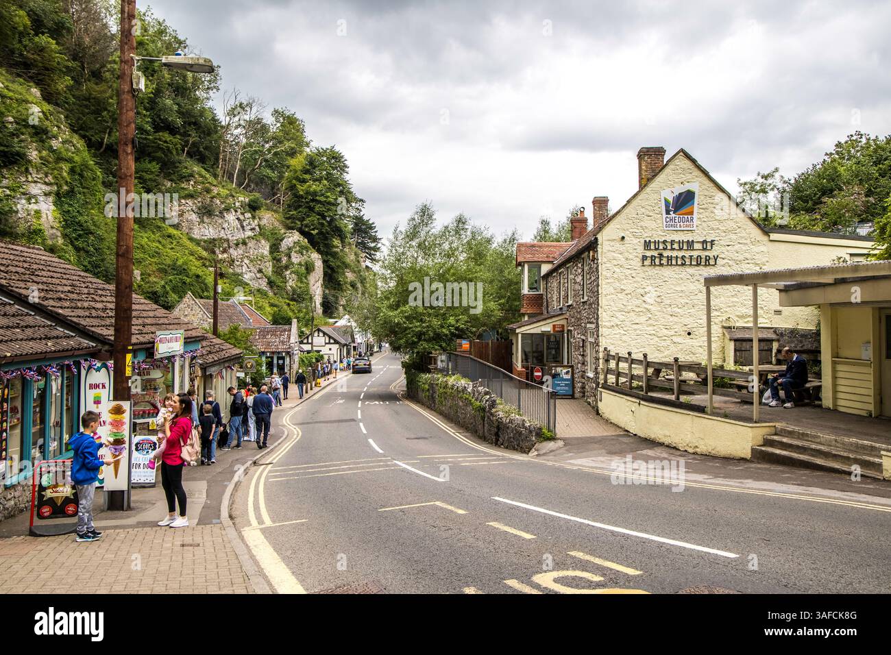 Cheddar, UK- August 4, 2023: Road going through Cheddar, a village ...