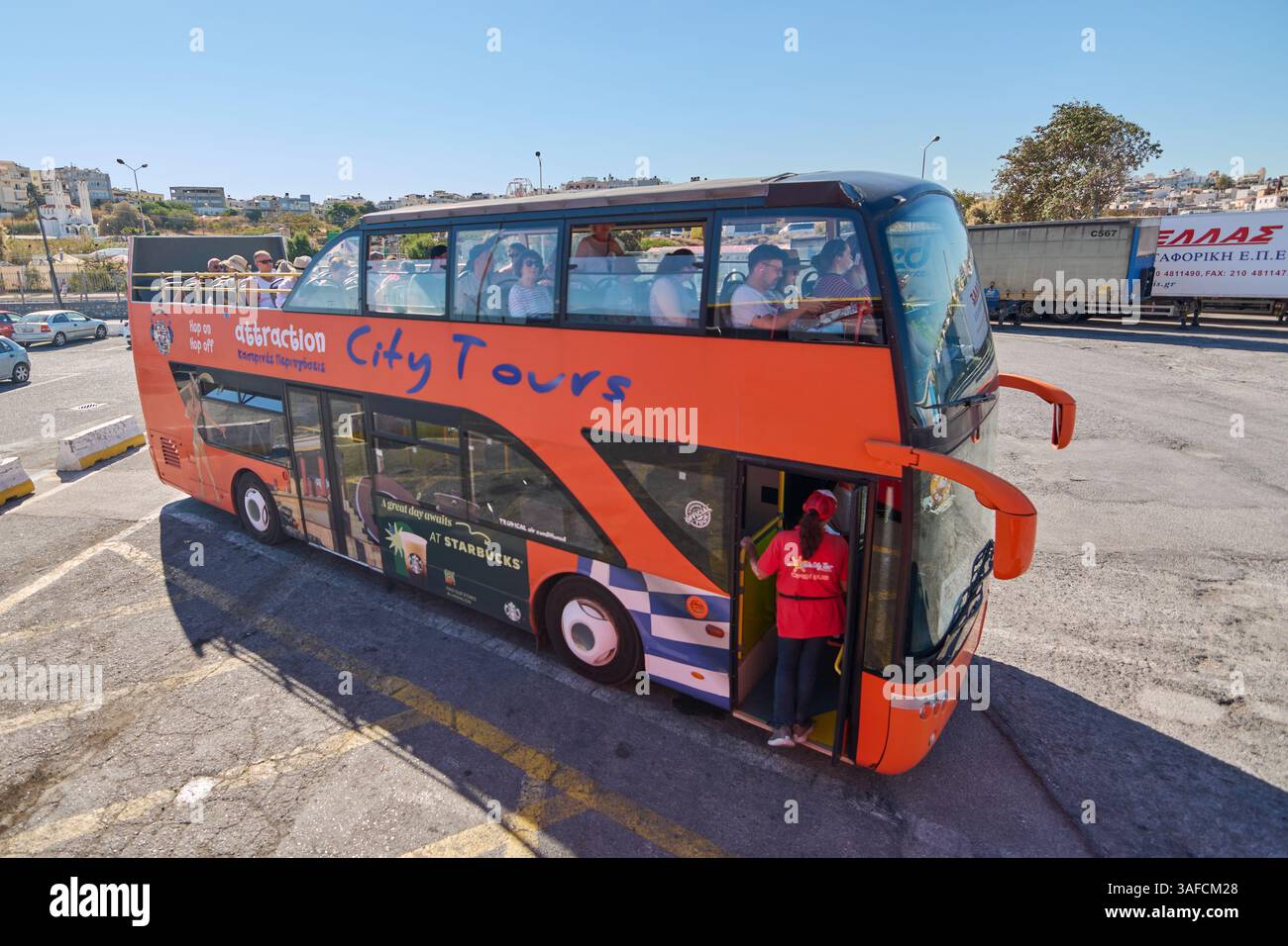 Crete.Greece - april 07, 2025: open-top tourist bus navigating ...