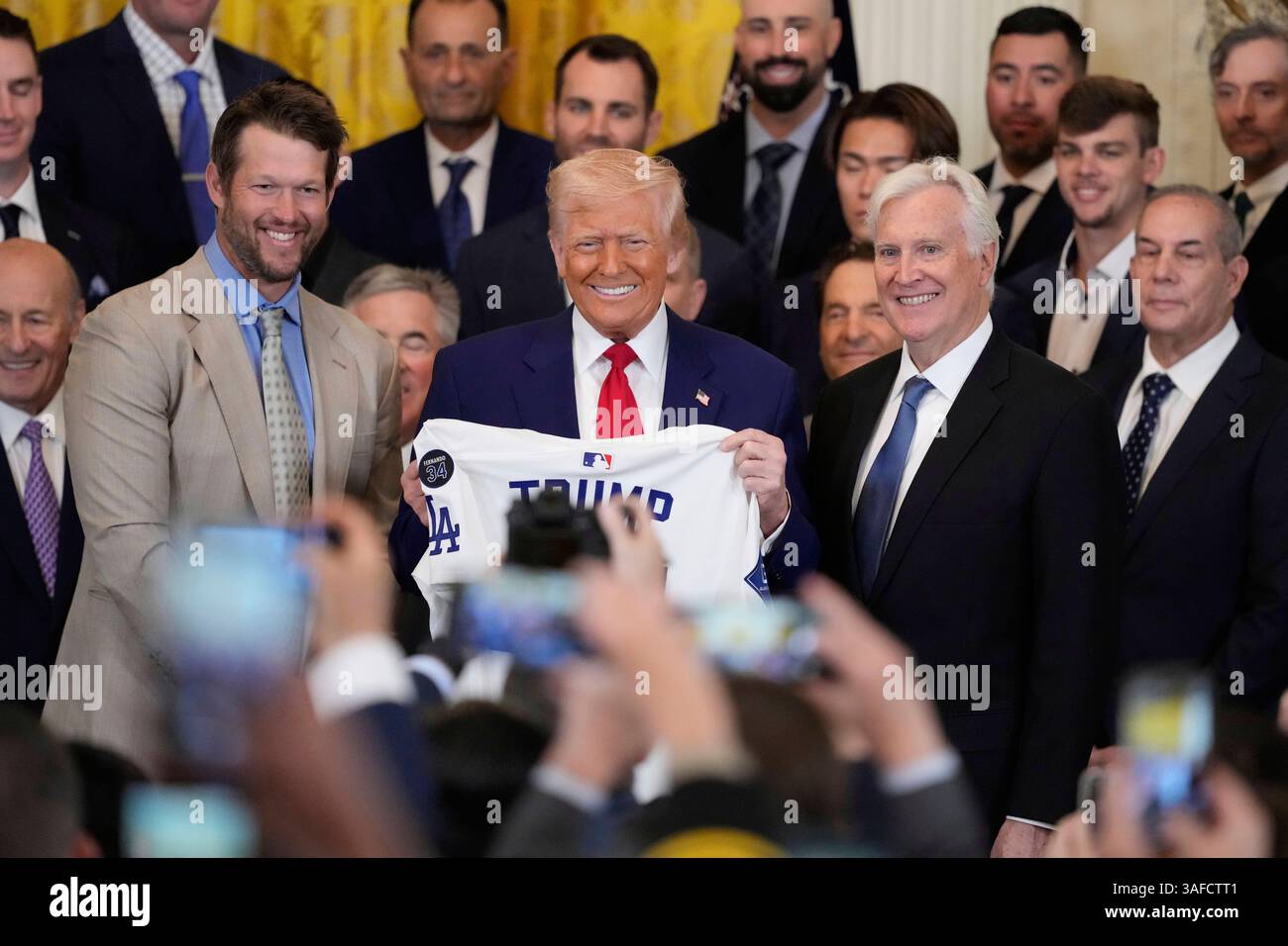 Los Angeles Dodgers' Clayton Kershaw, left, and owner Mark Walter ...
