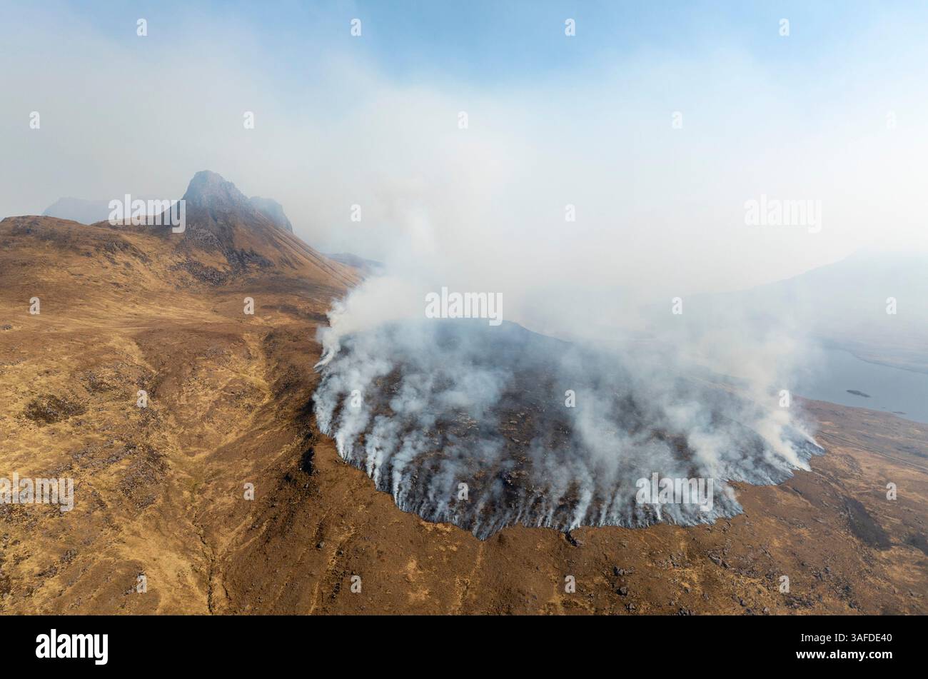 April 6th 2025. Wildfire below Stac Pollaidh mountain in the Coigach ...