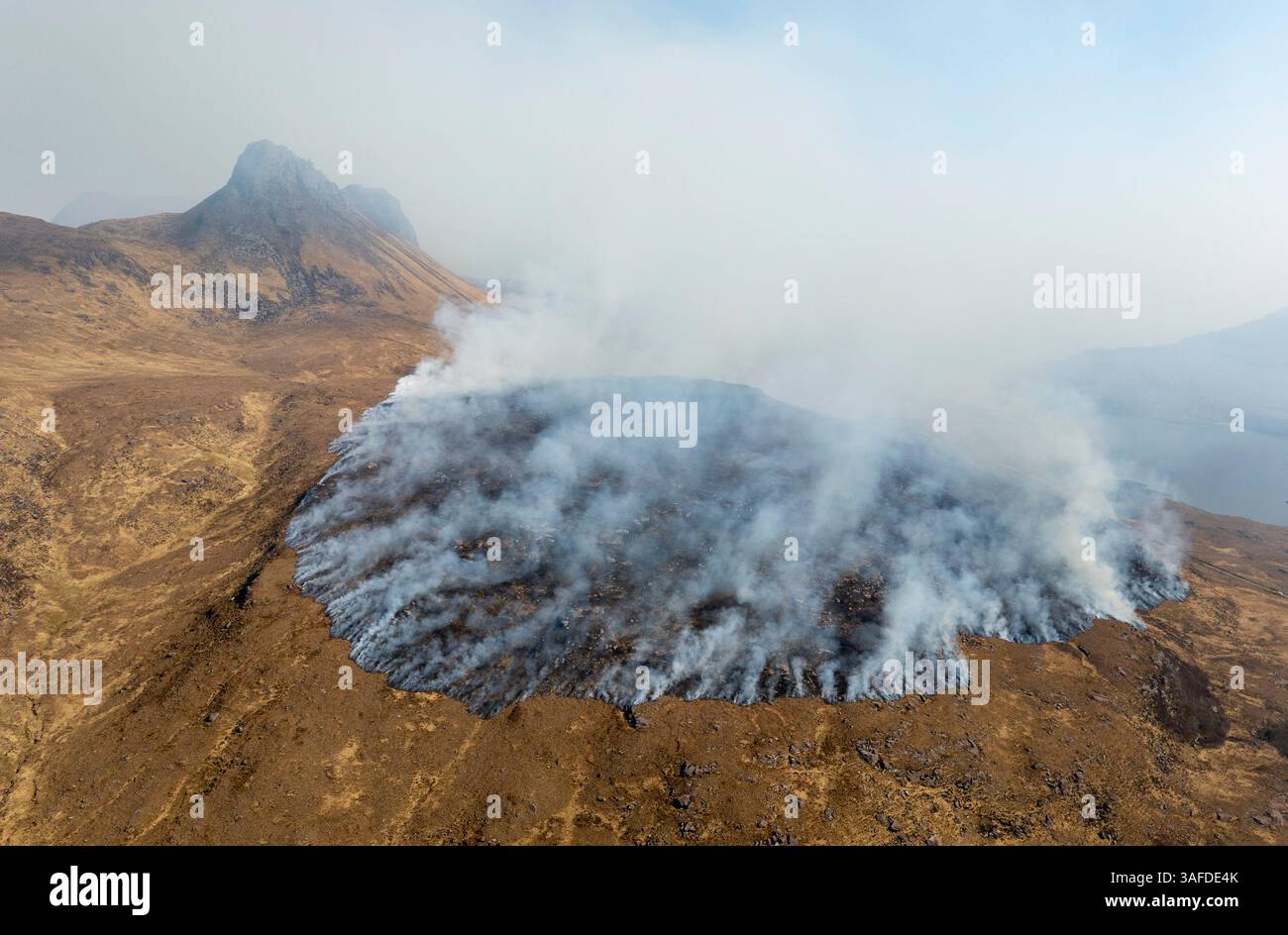 April 6th 2025. Wildfire below Stac Pollaidh mountain in the Coigach ...