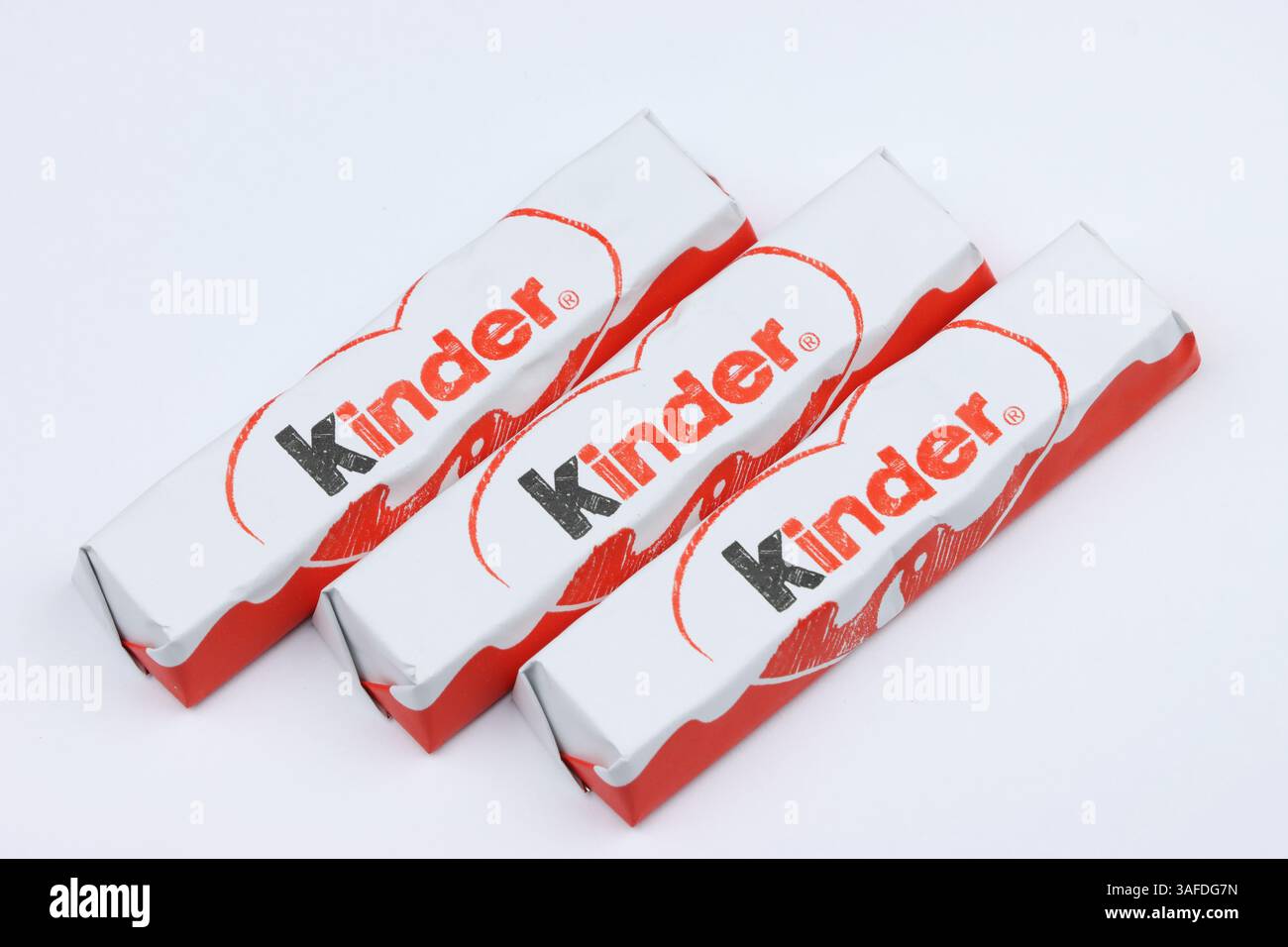 Kinder chocolate bars in red and white packaging on white background ...
