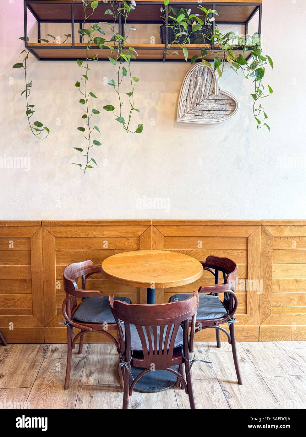 Contemporary cafe features inviting wooden hi-res stock photography and ...