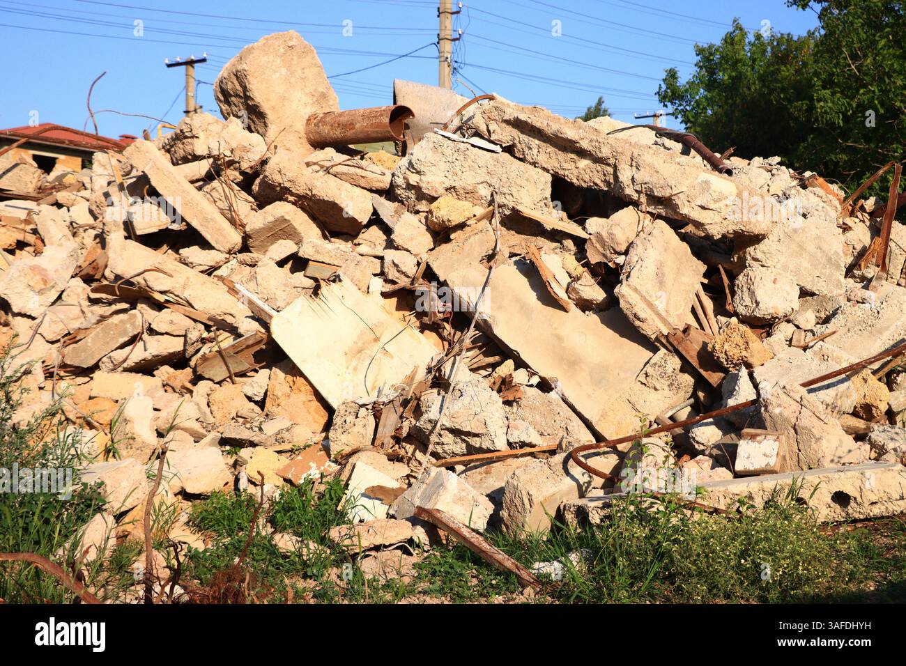 Pile of concrete rubble debris at a construction site with exposed ...