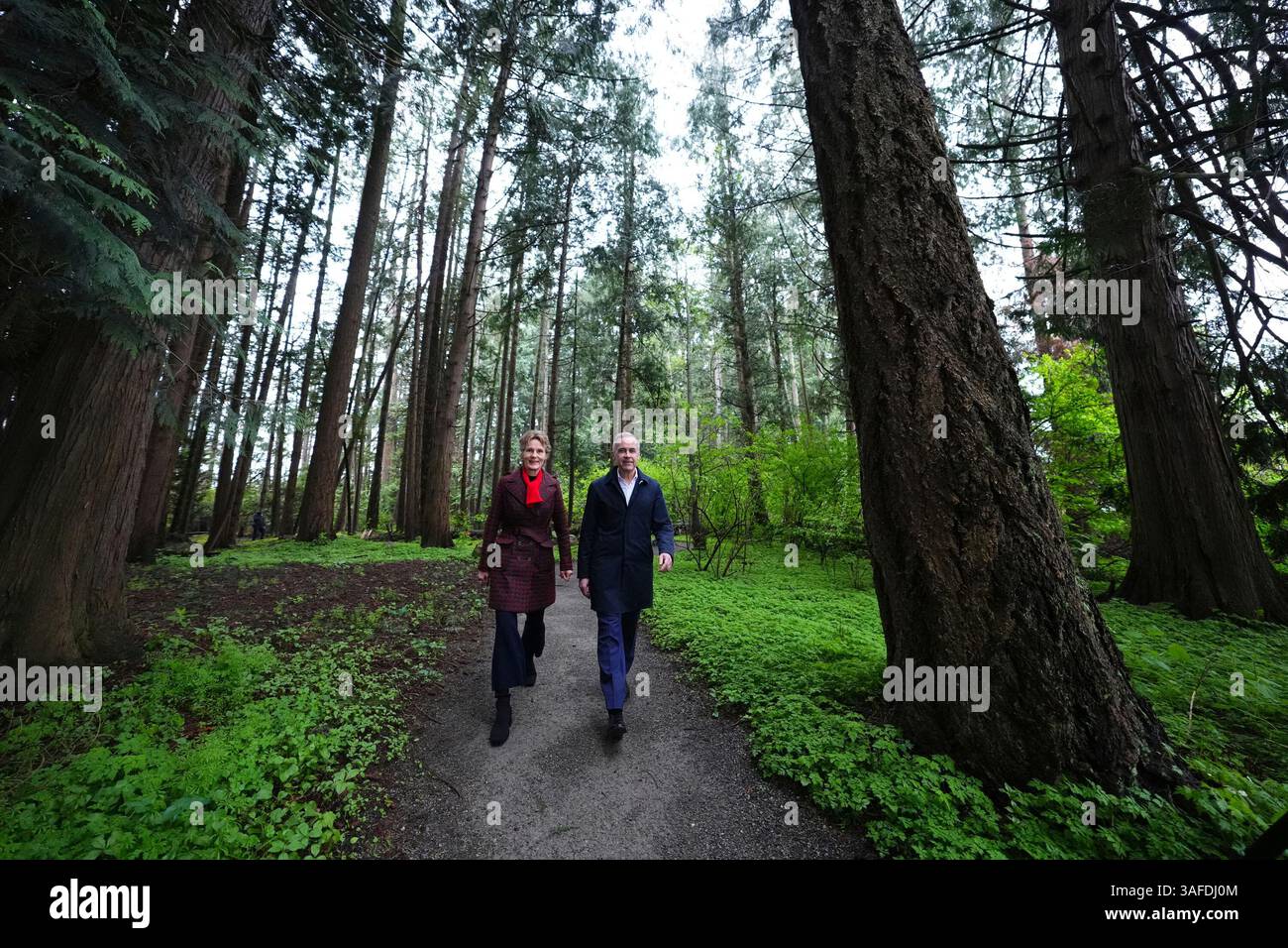 Liberal Leader Mark Carney walks with his wife, Diana Fox Carney, to ...