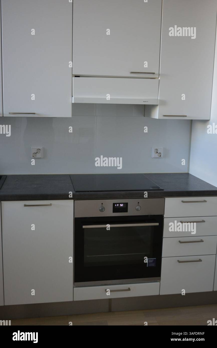 A typical Finnish kitchen with kitchenware, grey kitchen countertop ...