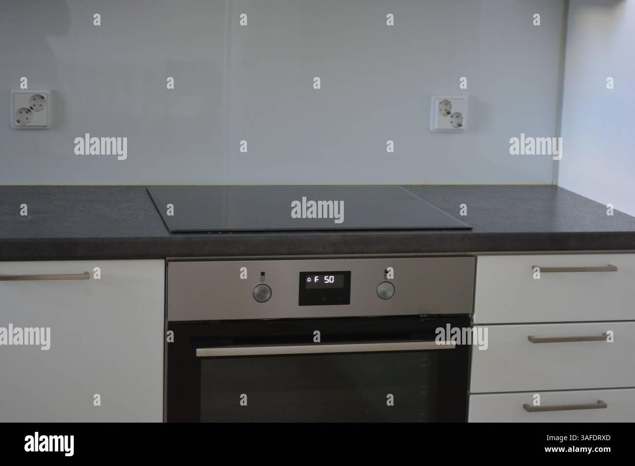 A typical Finnish kitchen with kitchenware, grey kitchen countertop ...