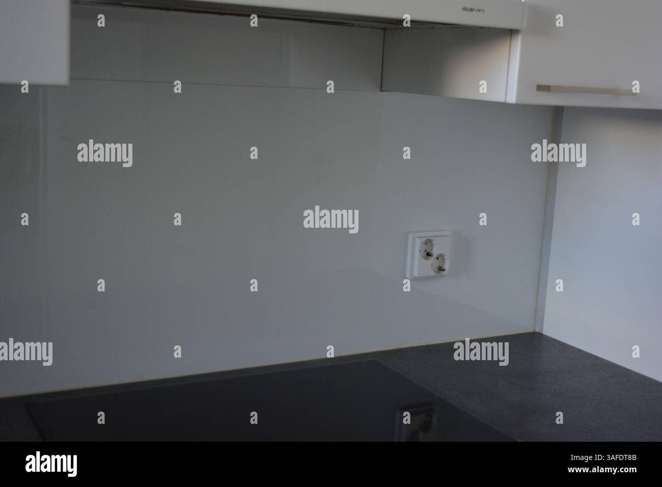 A typical Finnish kitchen with kitchenware, grey kitchen countertop ...