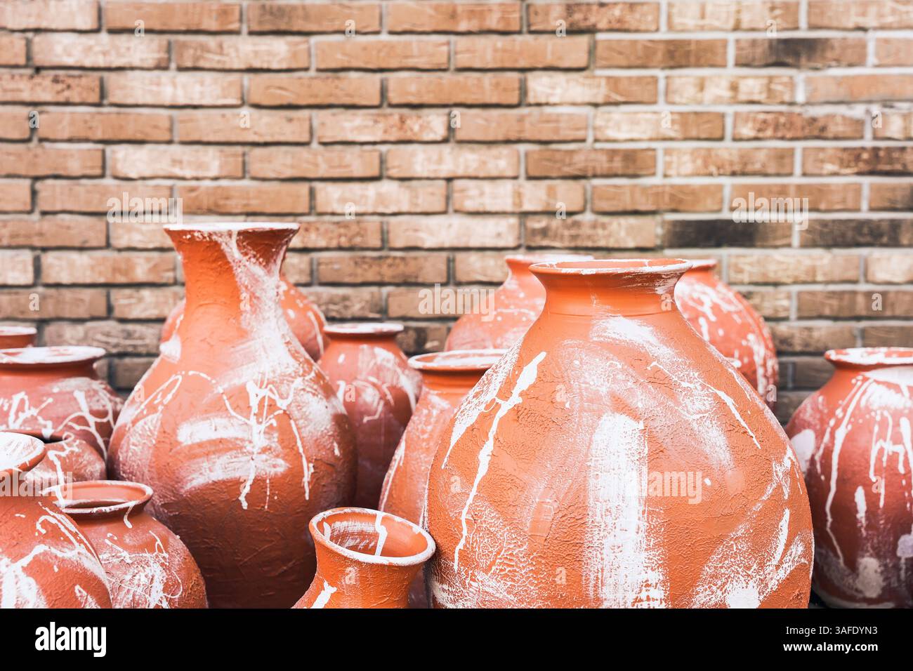 Upper parts of clay jugs of different sizes. Craft Stock Photo - Alamy