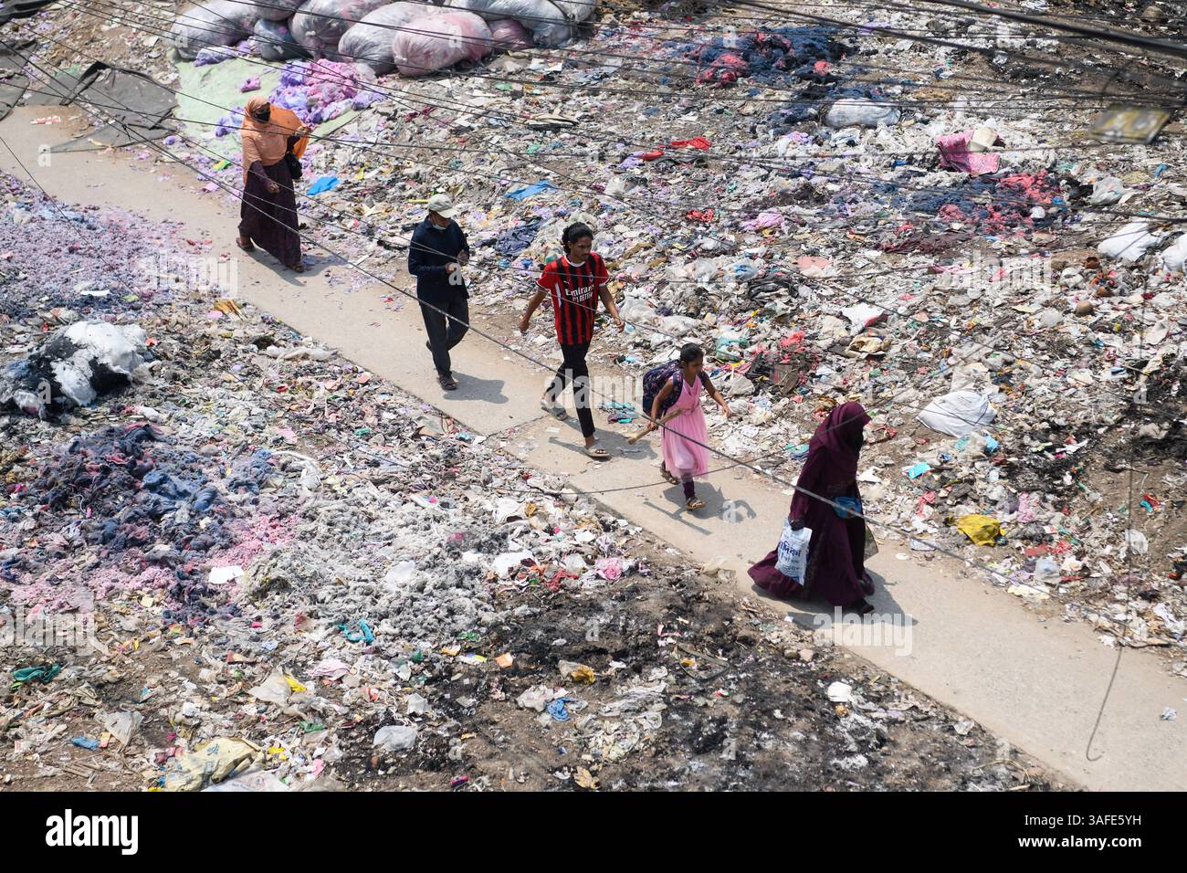 Savar, Bangladesh. 07th Apr, 2025. People walk through a street in the ...