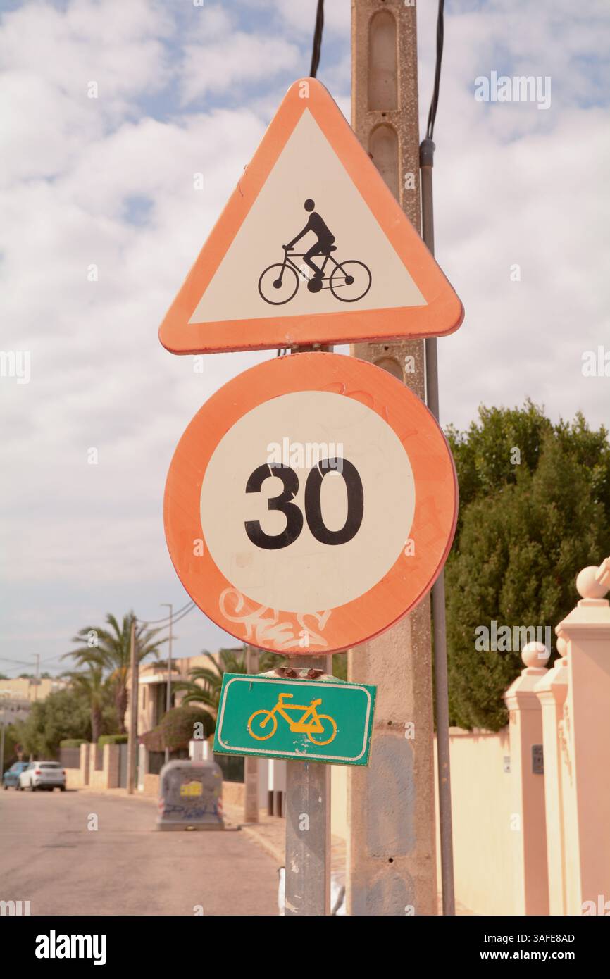 Trio of road signs - 30 kmh top speed limit and warning cyclists ...