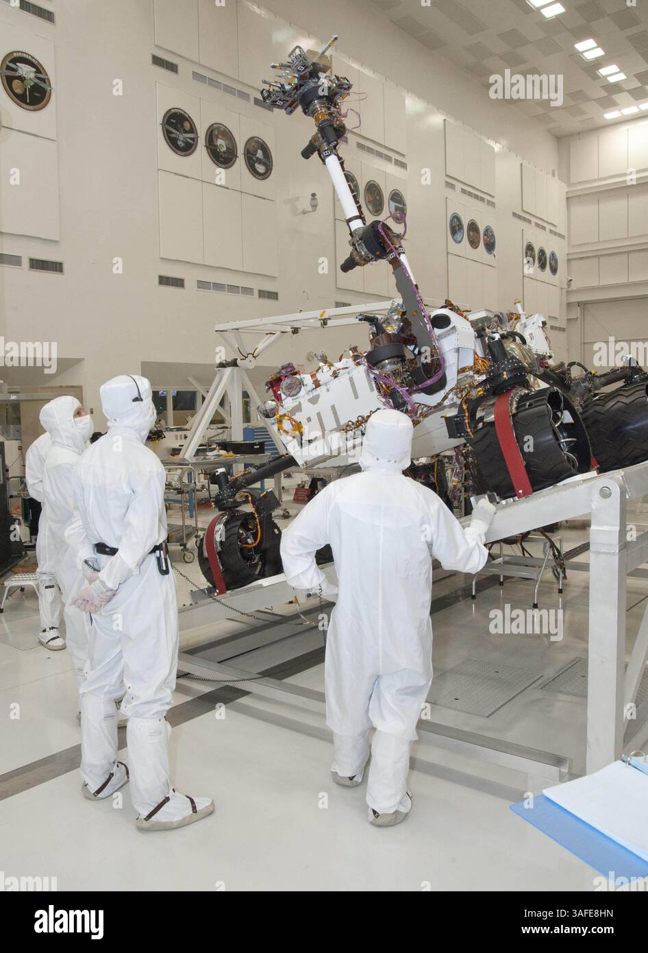 NASA's next Mars rover, Curiosity, stretches its robotic arm upward ...