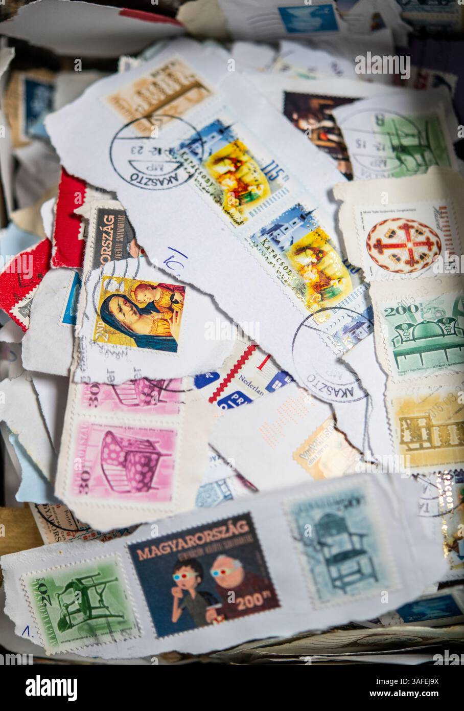 Pile of old used postage stamps Stock Photo - Alamy