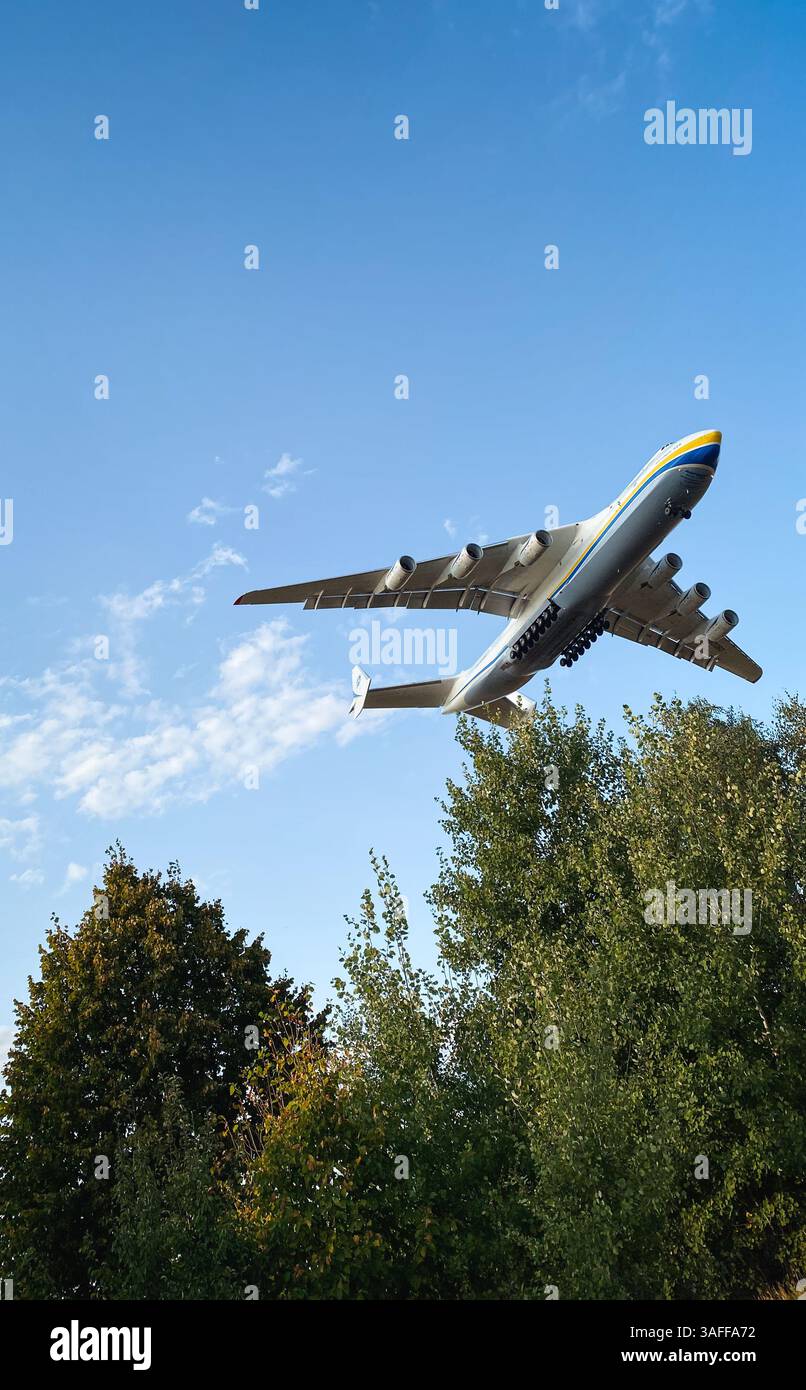 An-225 cargo plane on final approach to airport runway. Looking up at ...