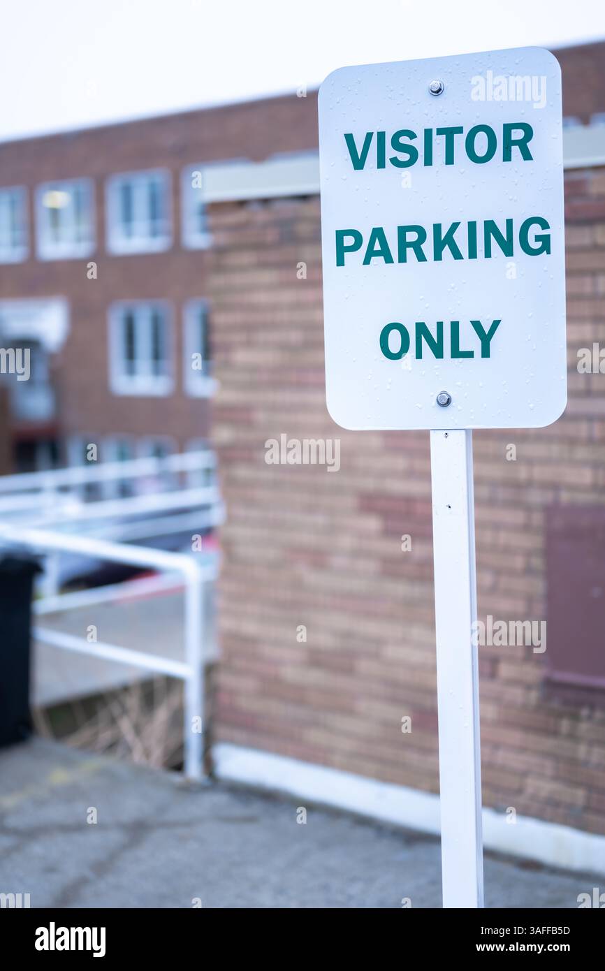 Visitor Parking Only Sign on a Parking Lot Stock Photo - Alamy