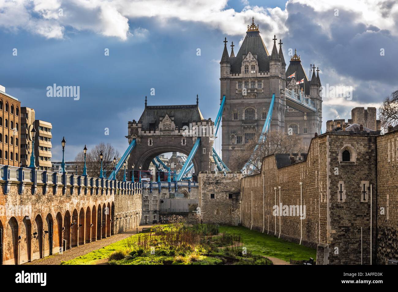 Tower Bridge rising behind medieval Tower of London fortress Stock ...