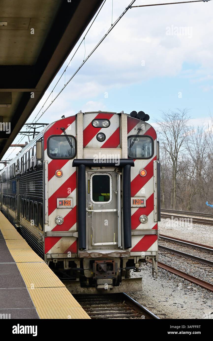 University Park, Illinois, USA. A Metra cab car leads an electric line ...