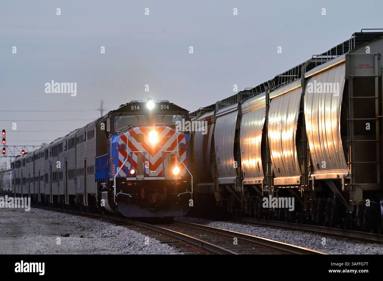 Frankin Park, Illinois, USA. With its lights reflection off hopper cars ...
