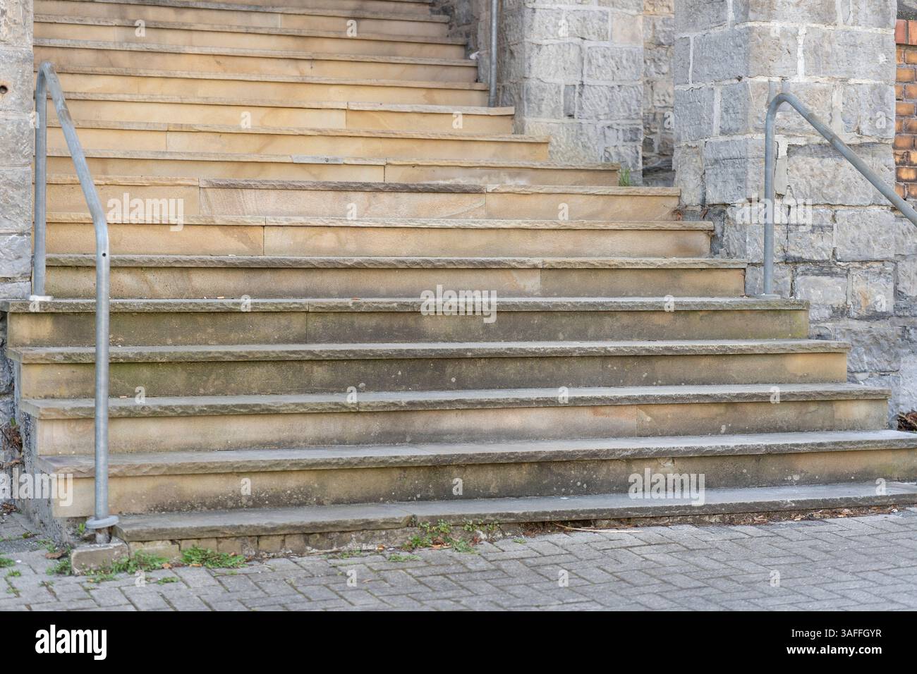 Wide stone staircase with metal handrails Stock Photo - Alamy
