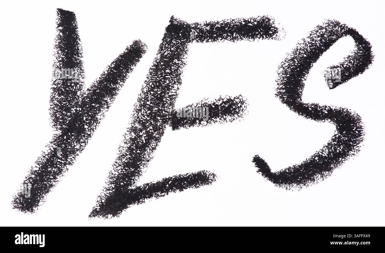 Word YES written in large, textured black crayon letters on a white ...