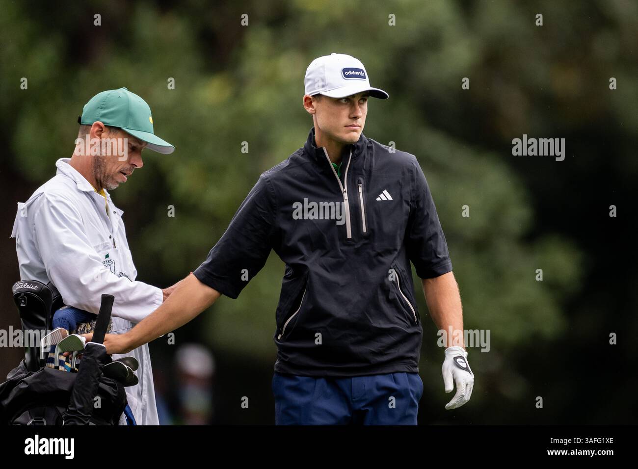 Ludvig Åberg of, Sweden. , . with caddie Joe Skovron during a practice ...