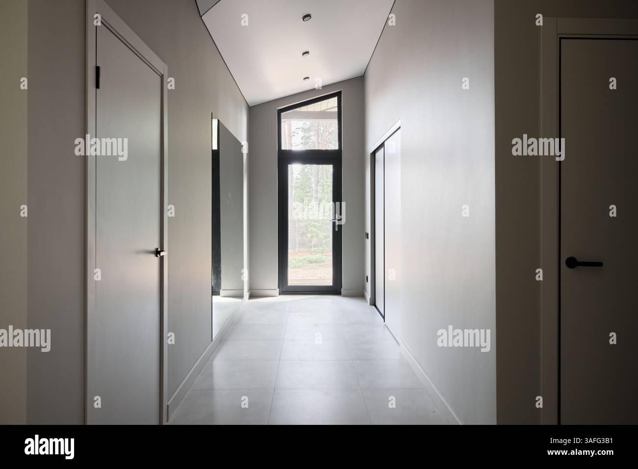 A Stunning Modern Hallway Featuring Large Windows and a Contemporary ...