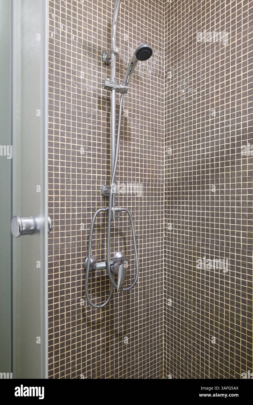 This Modern Shower Fixture integrates Mosaic Tiles, adding elegance to ...