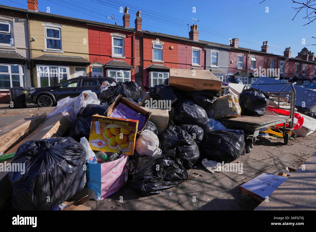 Rubbish piles up on a residential street in Birmingham, England, Monday ...