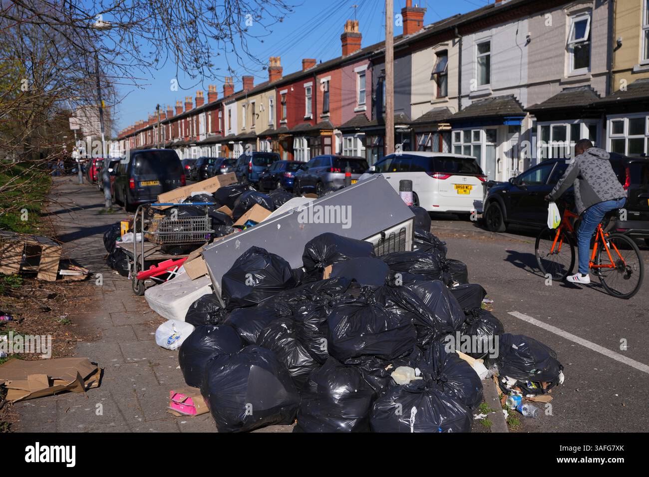 Rubbish piles up on a residential street in Birmingham, England, Monday ...
