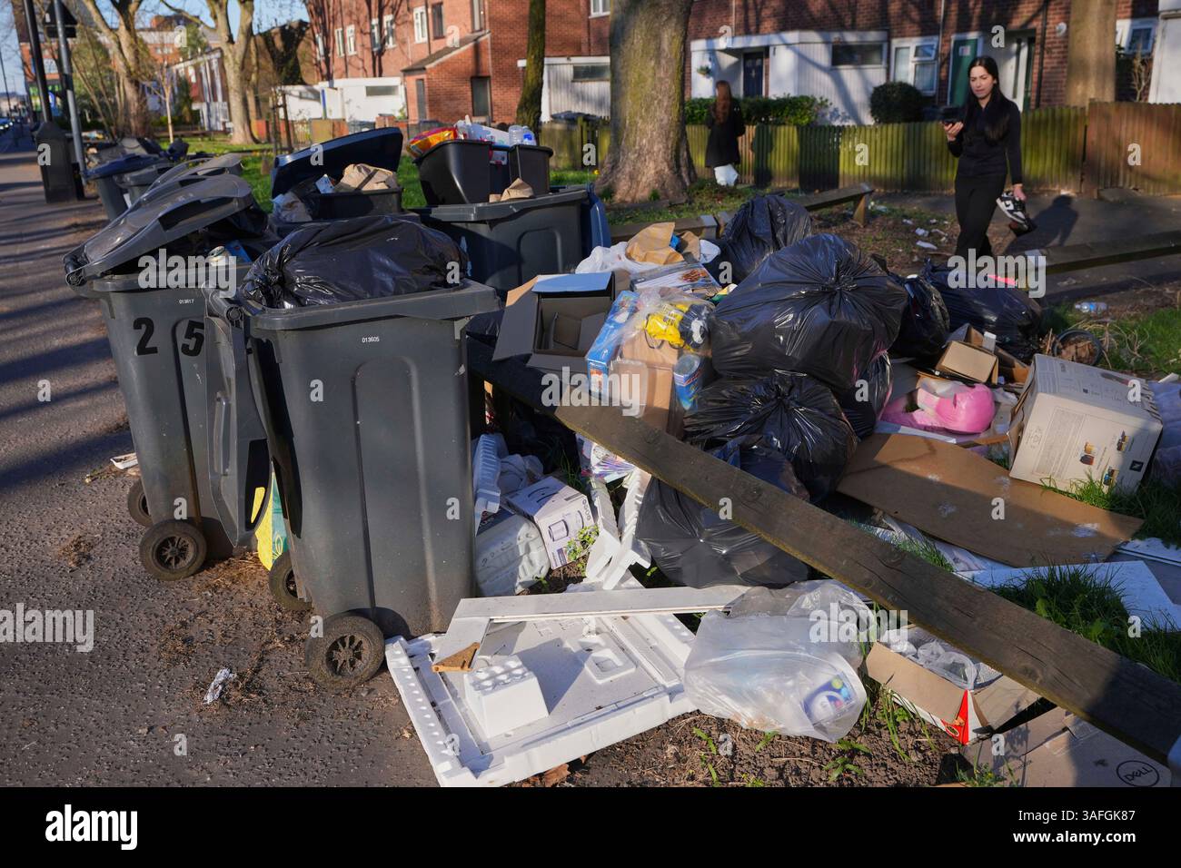 Rubbish piles up on a residential street in Birmingham, England, Monday ...