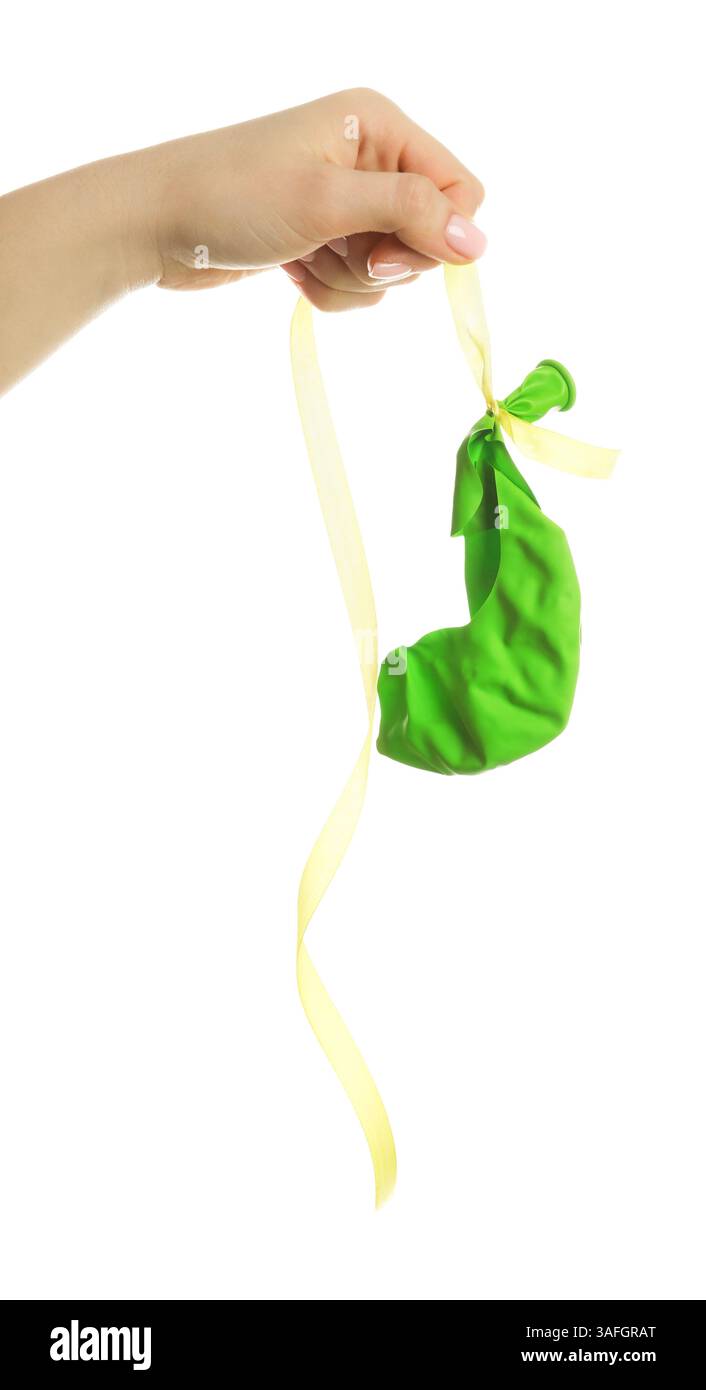 Woman holding popped green balloon on white background, closeup Stock ...