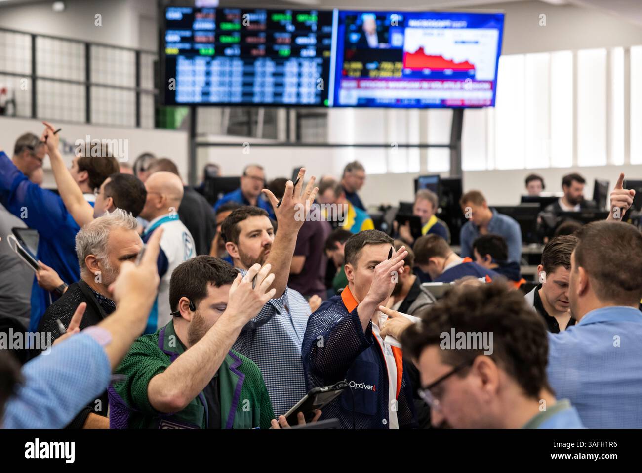 Traders work in the S&P options pit at the Cboe Options Exchange in the ...