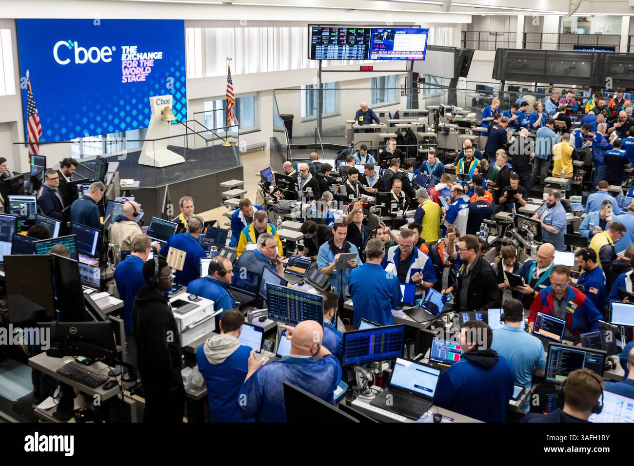 Traders work in the S&P options pit at the Cboe Options Exchange in the ...